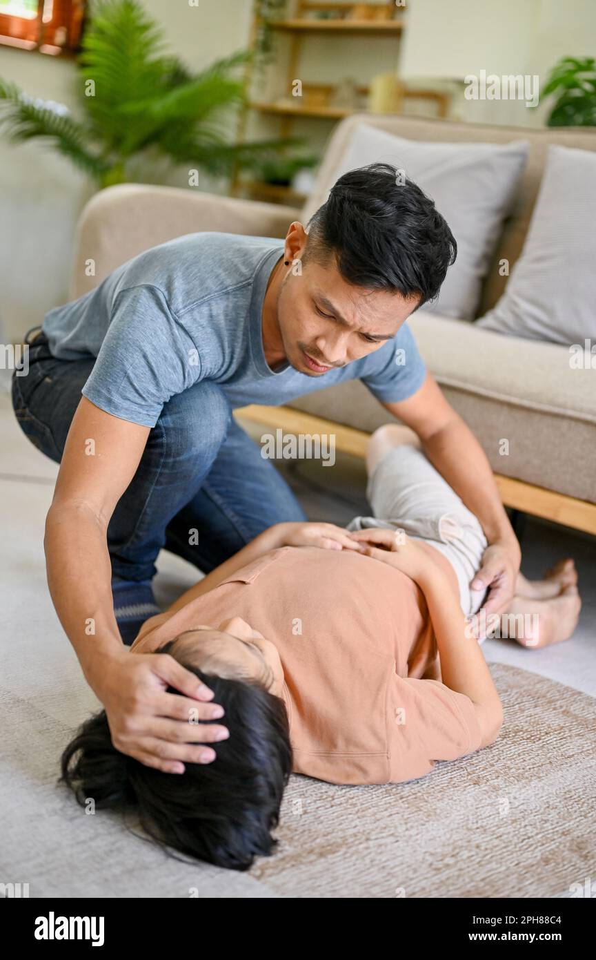Sick little son passed out on the living room floor and is being ...
