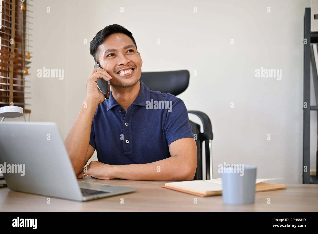 Smiling and happy millennial Asian businessmen having a good ...