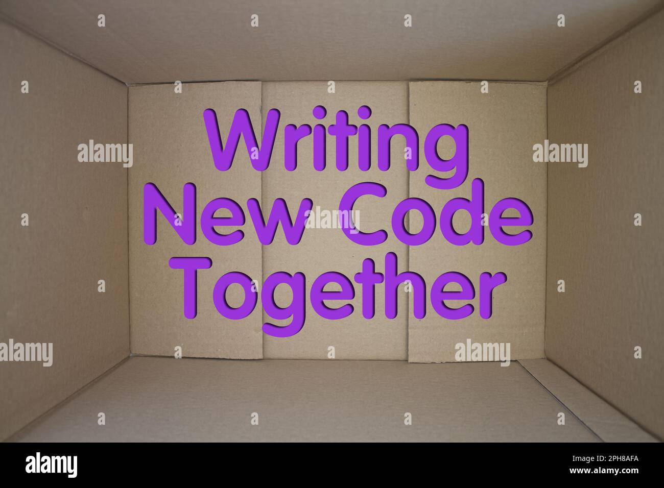 Writing New Code Together word with cardboard box. Brown folded card ...