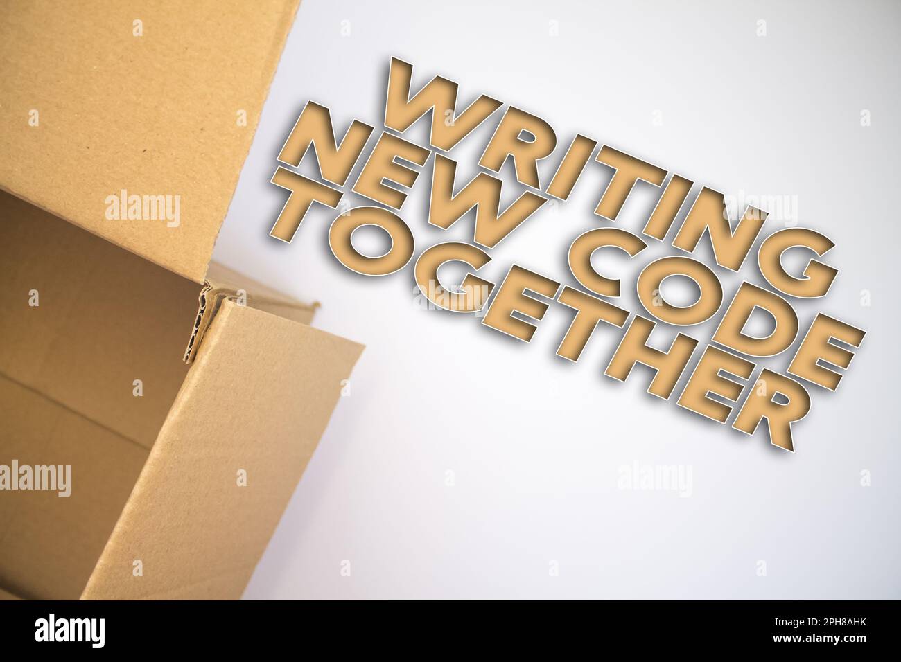 Writing New Code Together word with cardboard box. Brown folded card ...