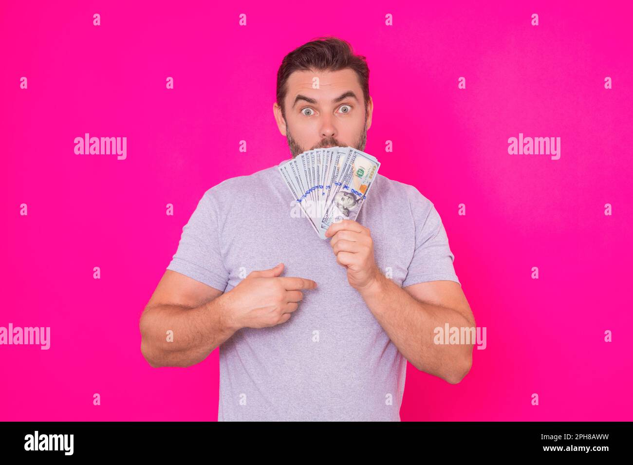 Man with money cash. Dollar banknotes. Portrait of man holding bunch of ...
