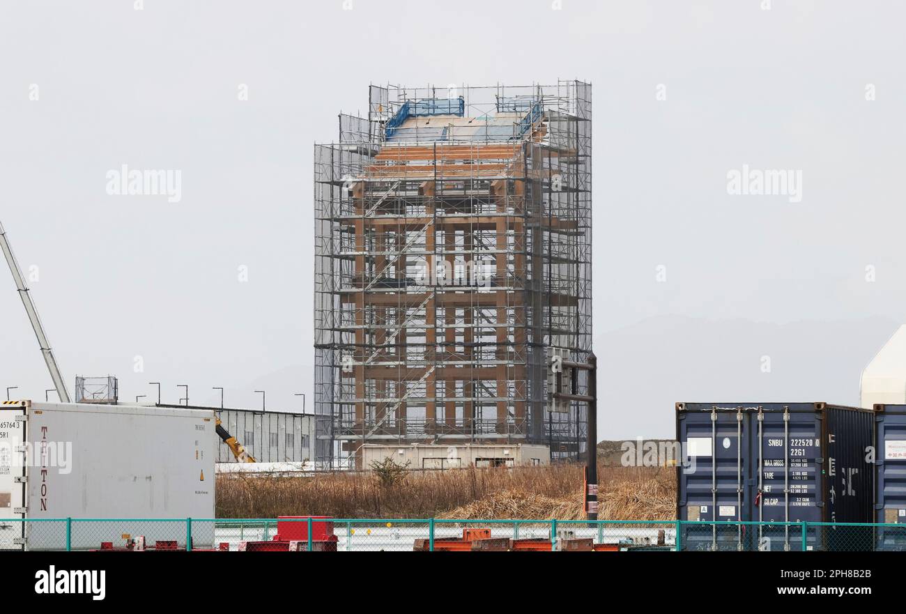 A photo shows a large wooden roof under construction as a symbol of the ...