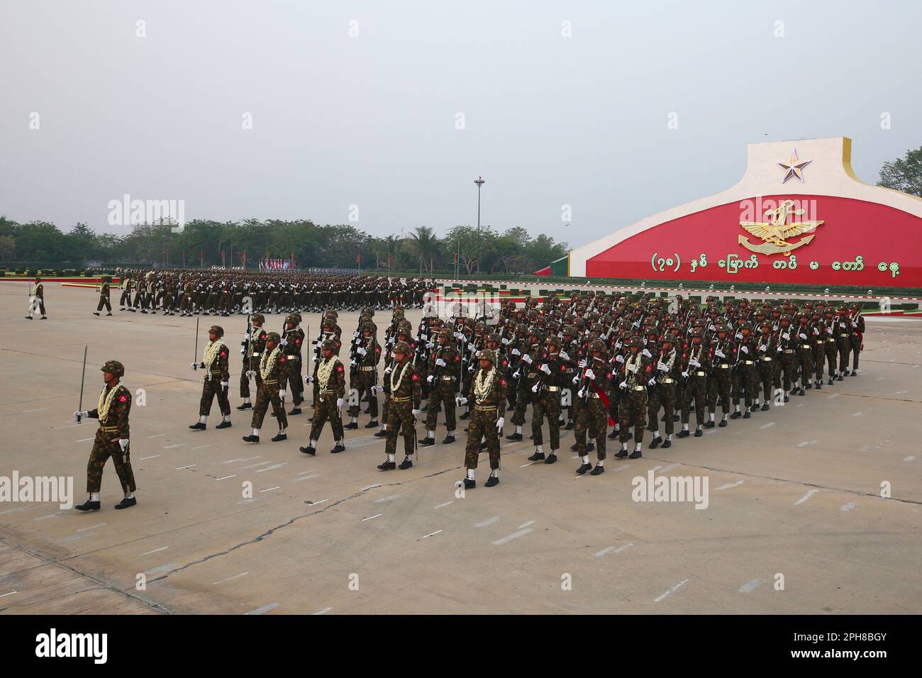 Military officers march during a parade to commemorate Myanmar's 78th ...
