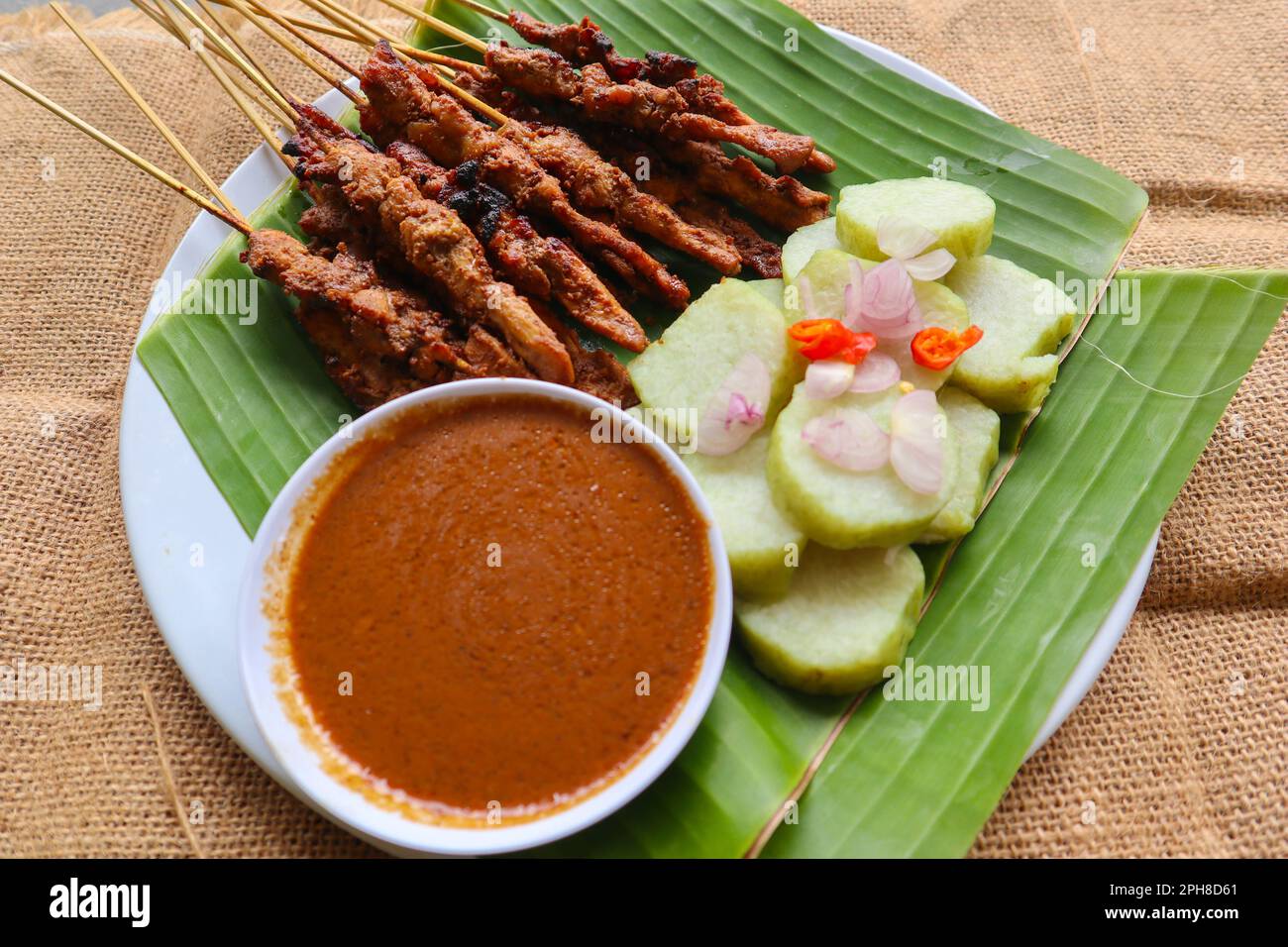 chicken satay or chicken satay served with lontong, rice cake and ...