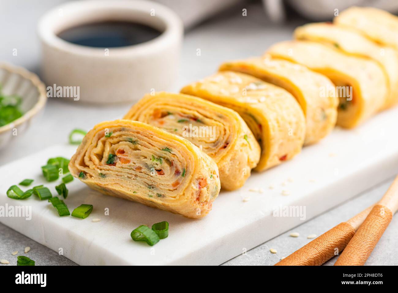Tamagoyaki, Japanese rolled omelette, on a ceramic plate Stock Photo ...