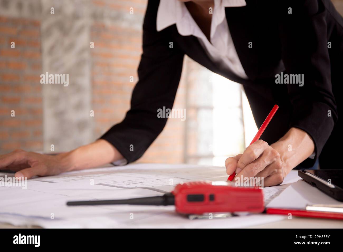 Closeup hands young caucasian architect woman looking laptop and ...