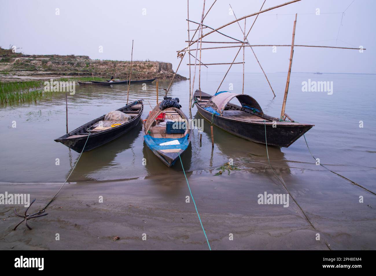 landscape view of Some wooden fishing boats on the shore of the Padma ...