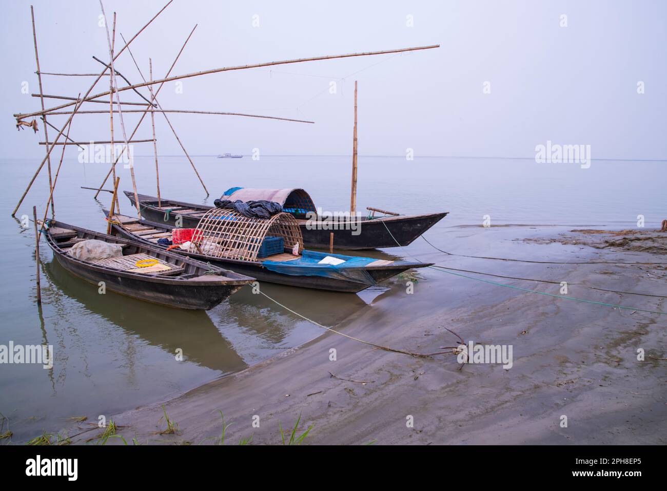 landscape view of Some wooden fishing boats on the shore of the Padma ...