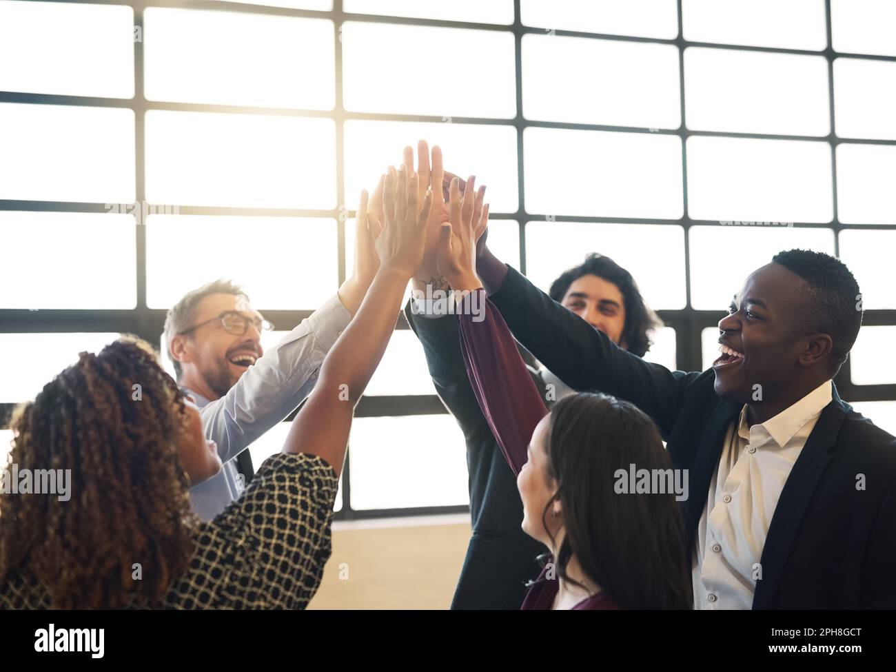 We give our best every day. a diverse team of happy businesspeople high ...