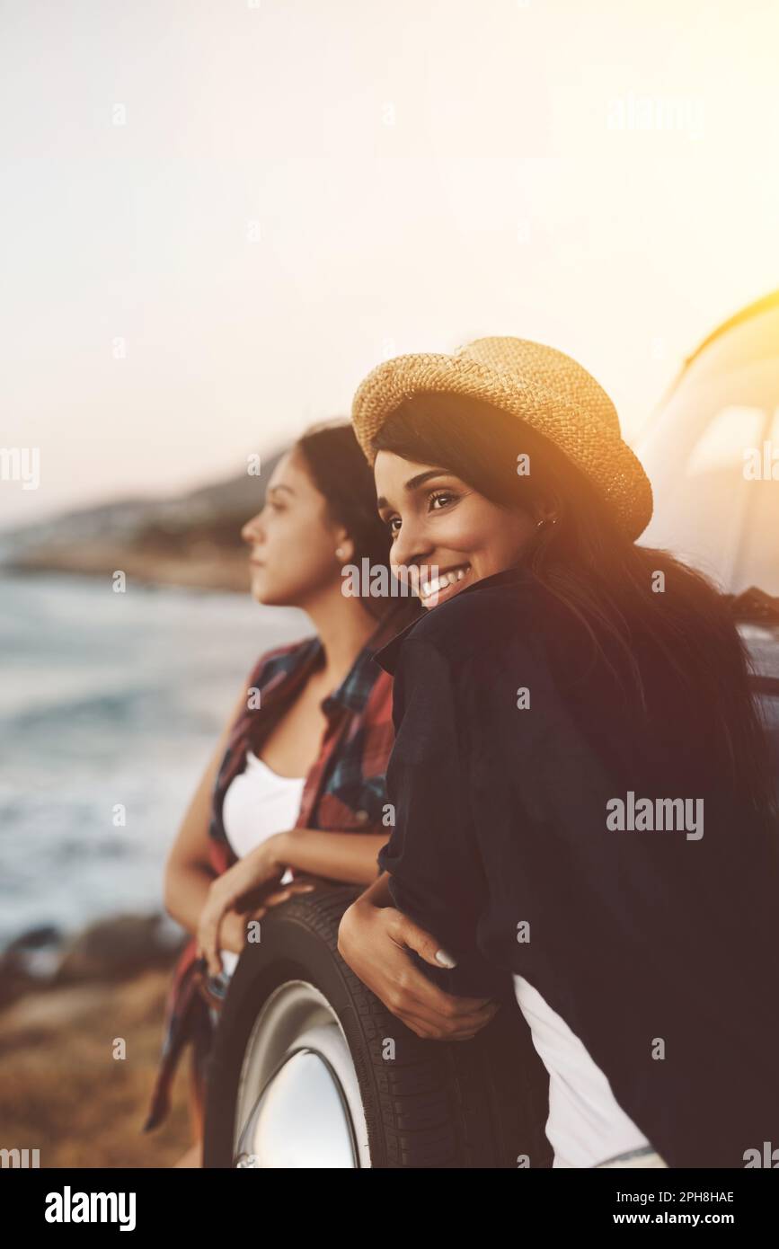 Getaway to where is good. two young friends stopping at the beach ...