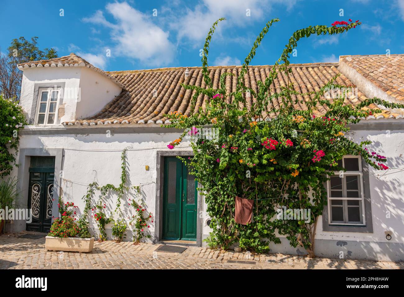 Facade of small stone house in old Faro. Algarve, Portugal Stock Photo ...