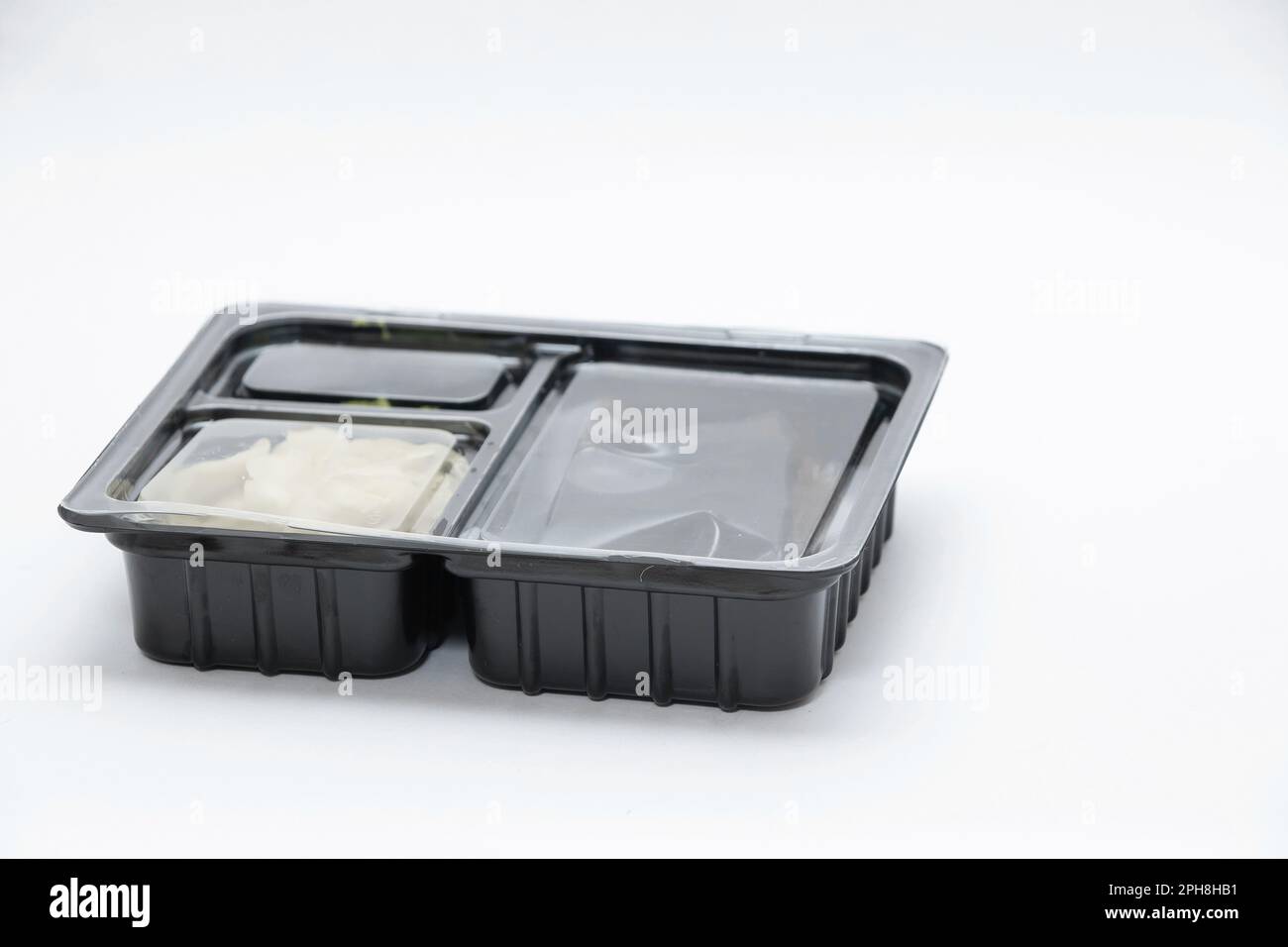 plastic food container with sushi from restaurant on isolated ...