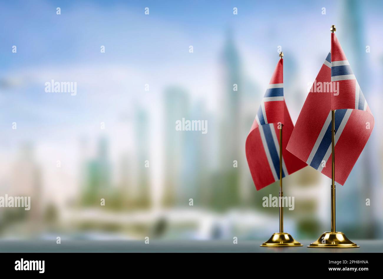 Small flags of the Norway on an abstract blurry background Stock Photo ...