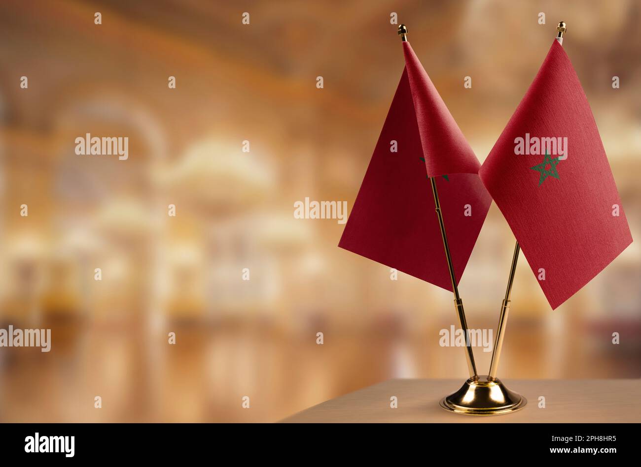 Small flags of the Morocco on an abstract blurry background Stock Photo ...