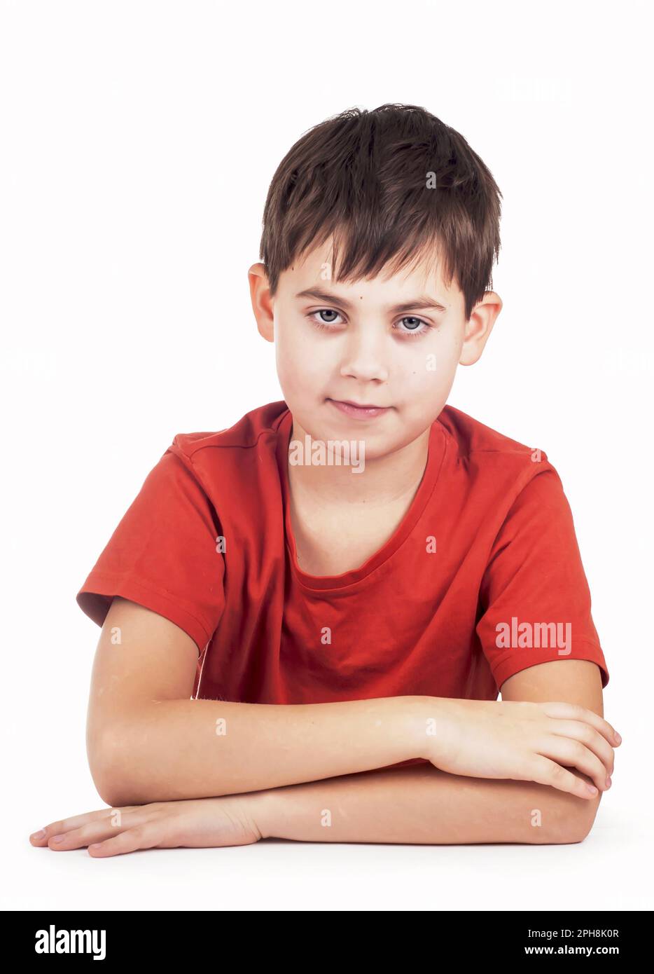 Portrait of a boy raising his arms against a white background Stock ...