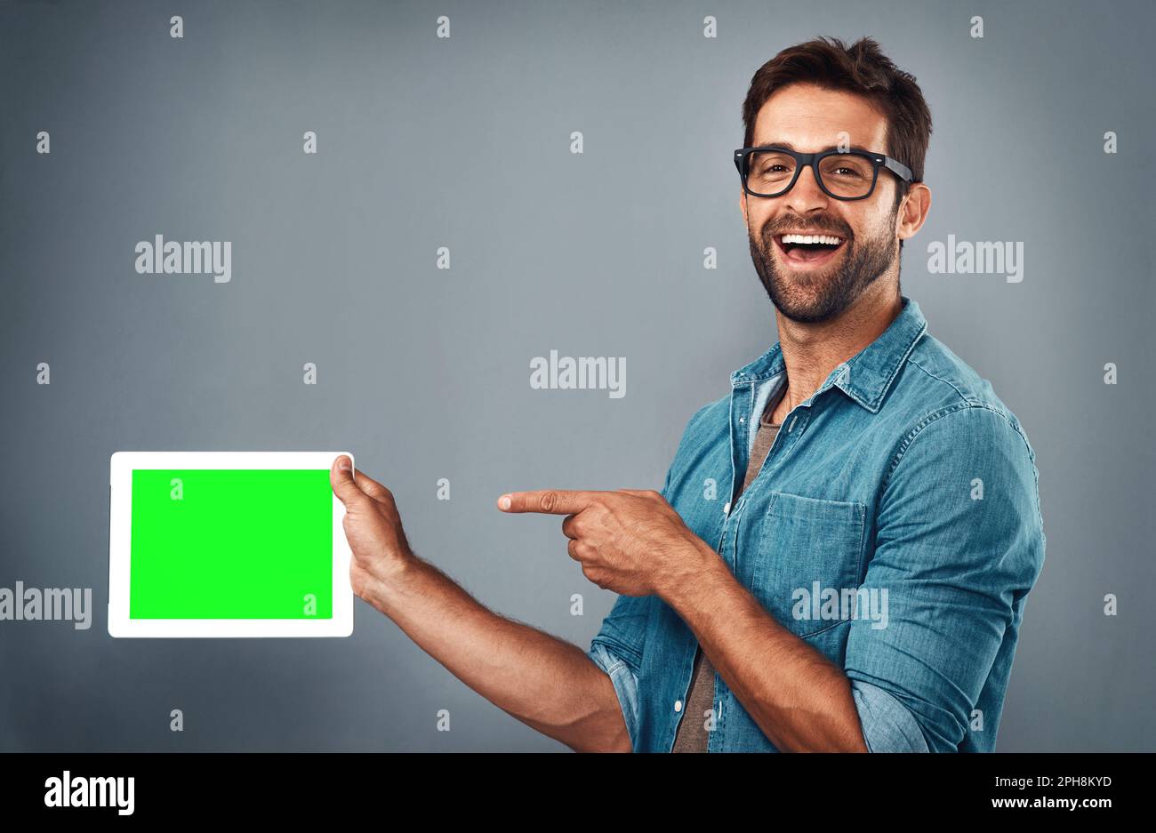 Have you seen this meme. Studio shot of a handsome young man showing a ...