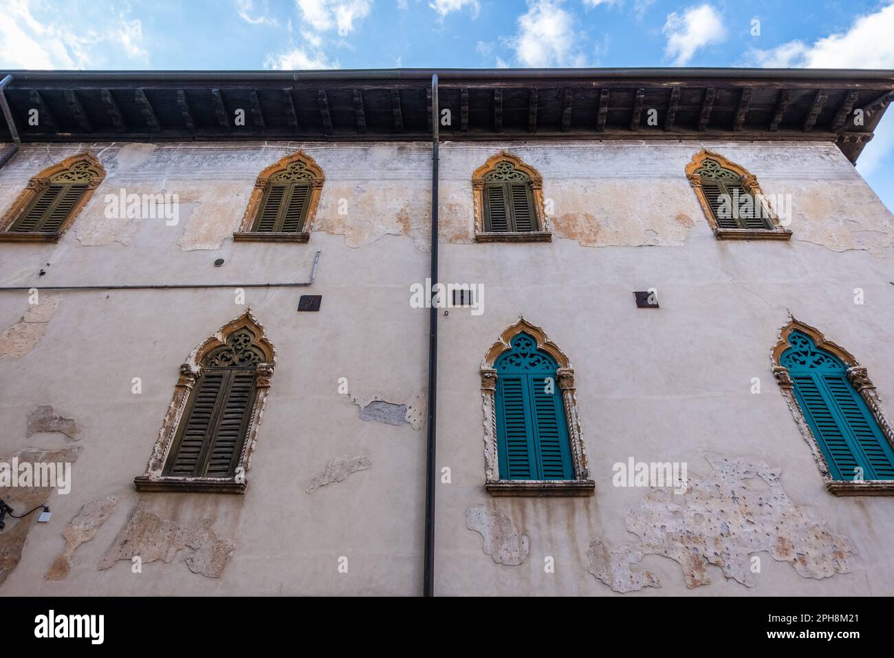 Ancient palace in Verona with new and green painted windows Stock Photo ...