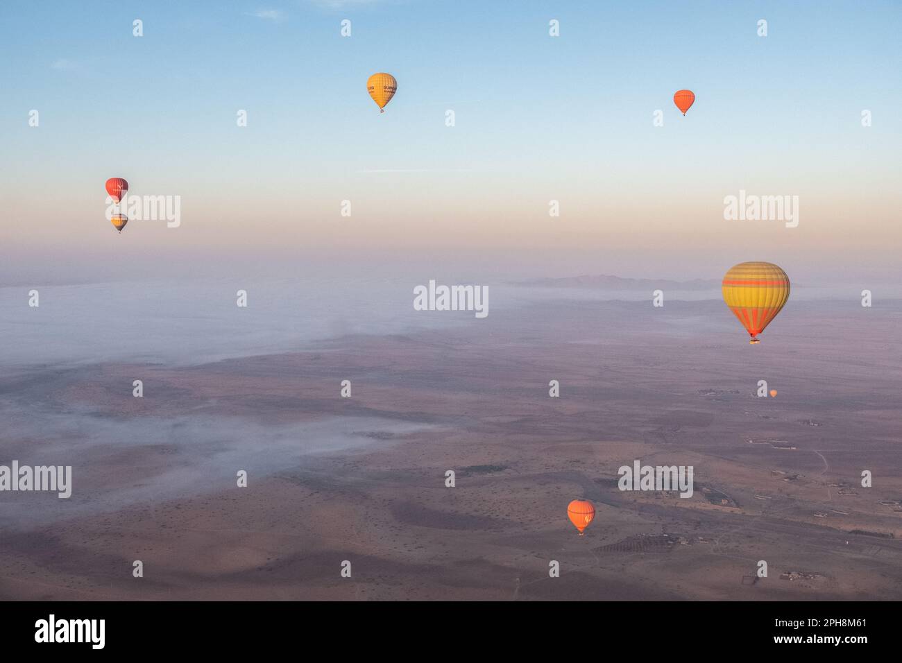 Gorgeous aerial view of hot air balloons flying over the Marrakech ...
