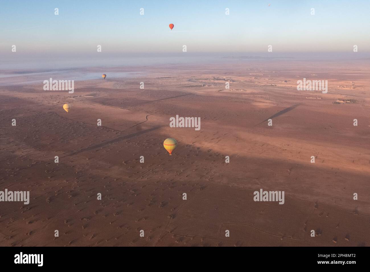 Aerial view of hot air balloons gliding through the Marrakech skies ...