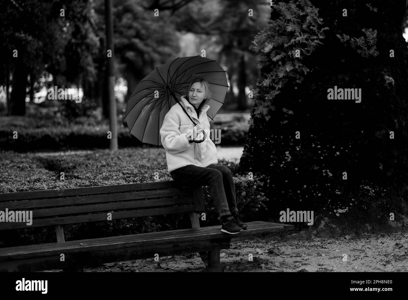 Girl Sitting Alone In Rain