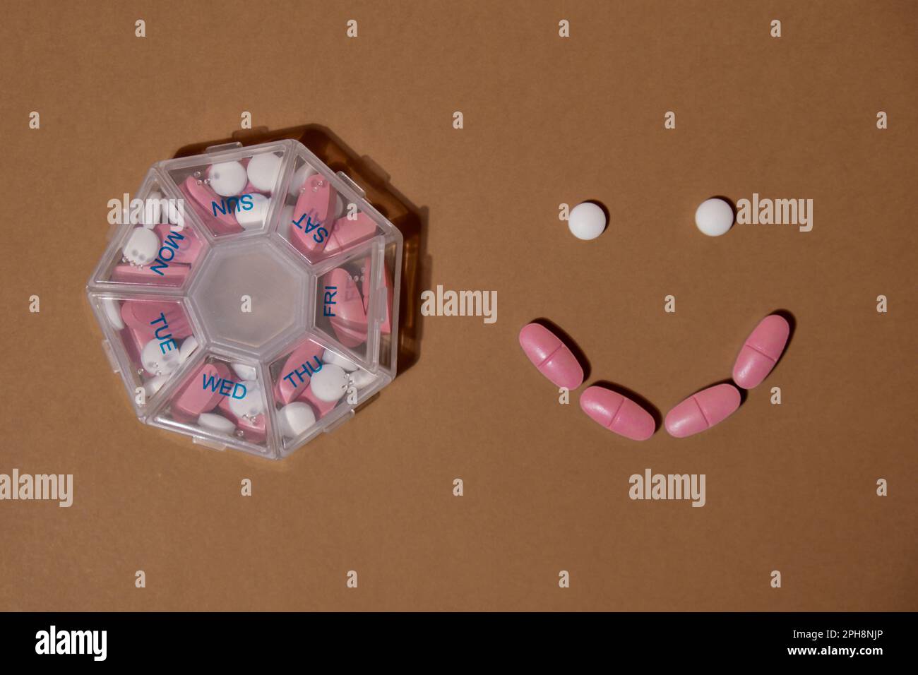 Organizer weekly shots with smile made of tablets for daily take ...