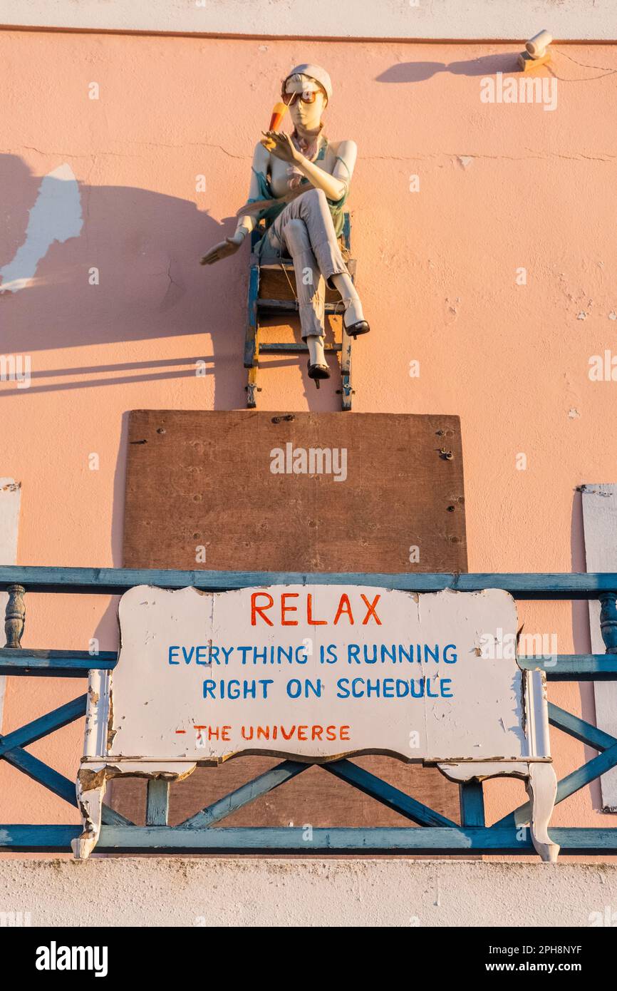 Funny statue with message in Oia town in Santorini island in Greece ...