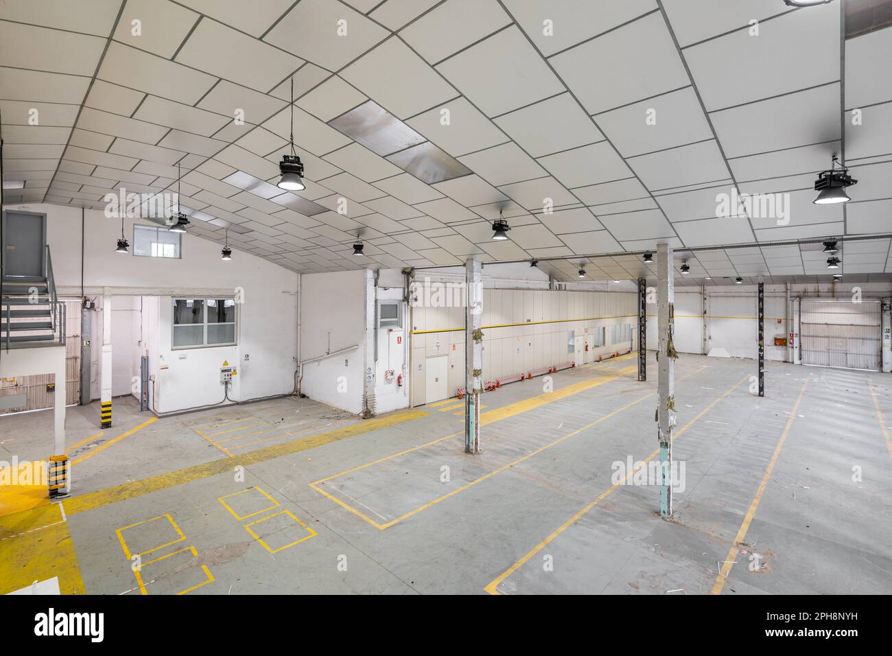 Top view of an empty auto repair shop or car park with natural light ...