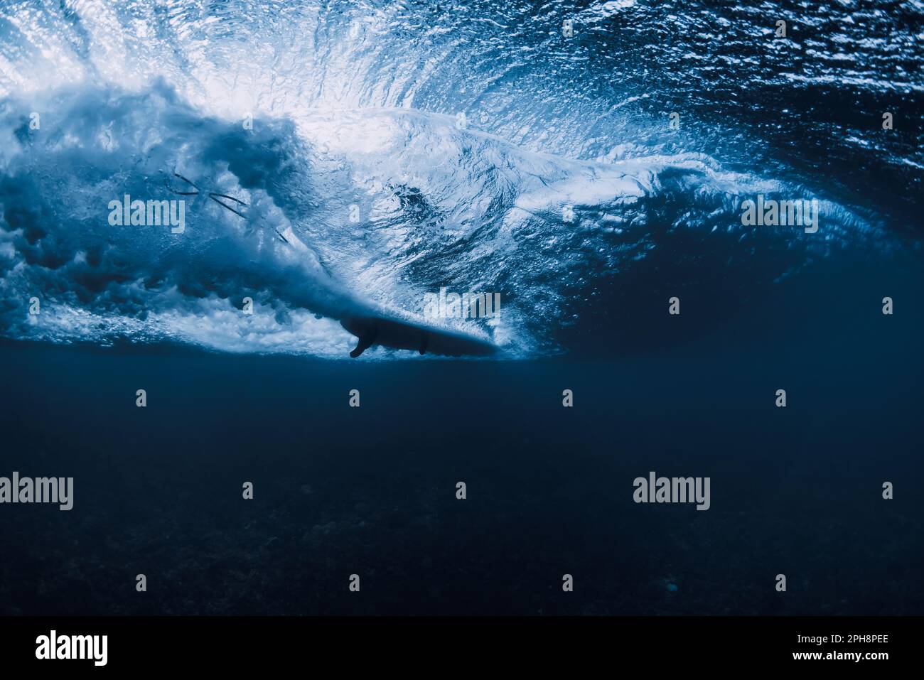Wave underwater and surfer ride on surfboard in ocean. Underwater ...