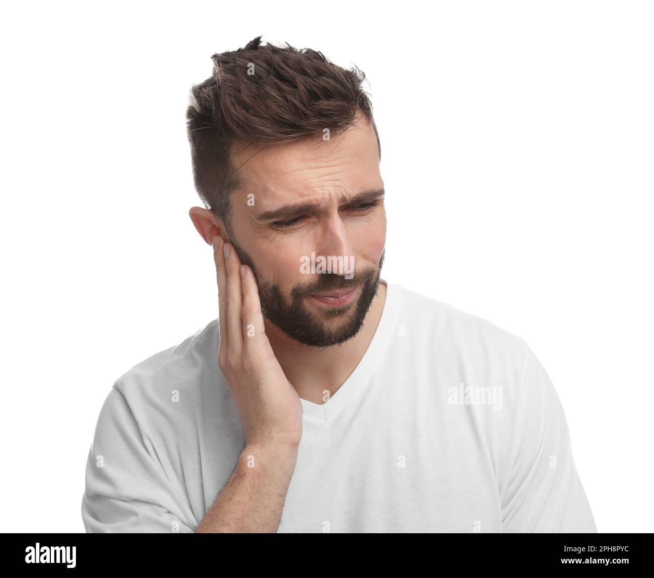 Man suffering from ear pain on white background Stock Photo - Alamy