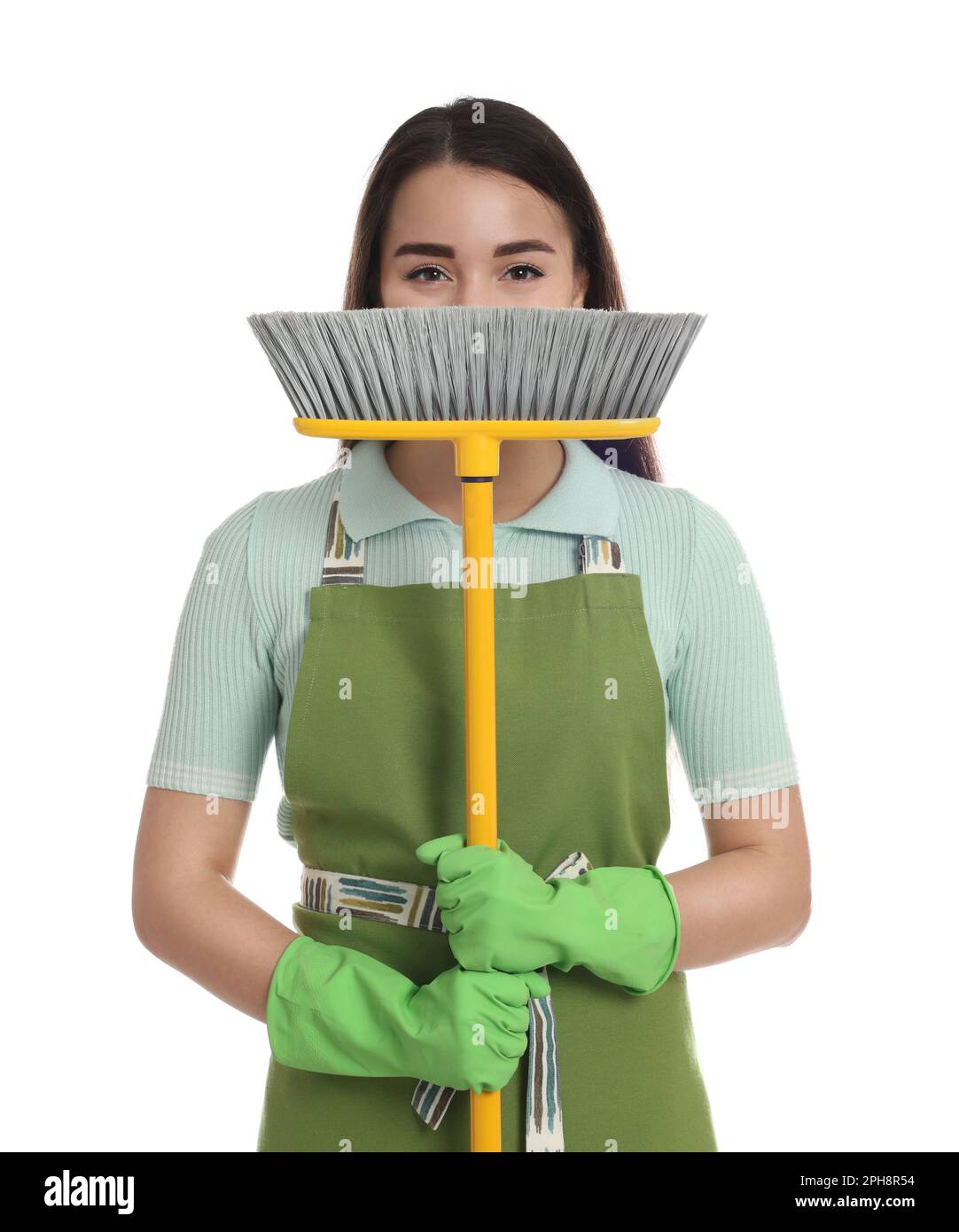 Beautiful young woman with broom on white background Stock Photo - Alamy