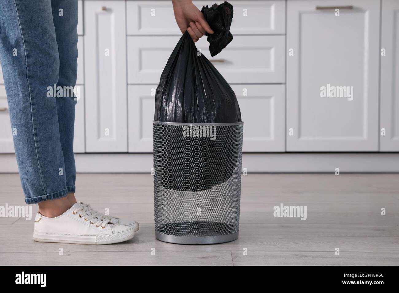 Woman taking garbage bag out of bin at home, closeup Stock Photo - Alamy