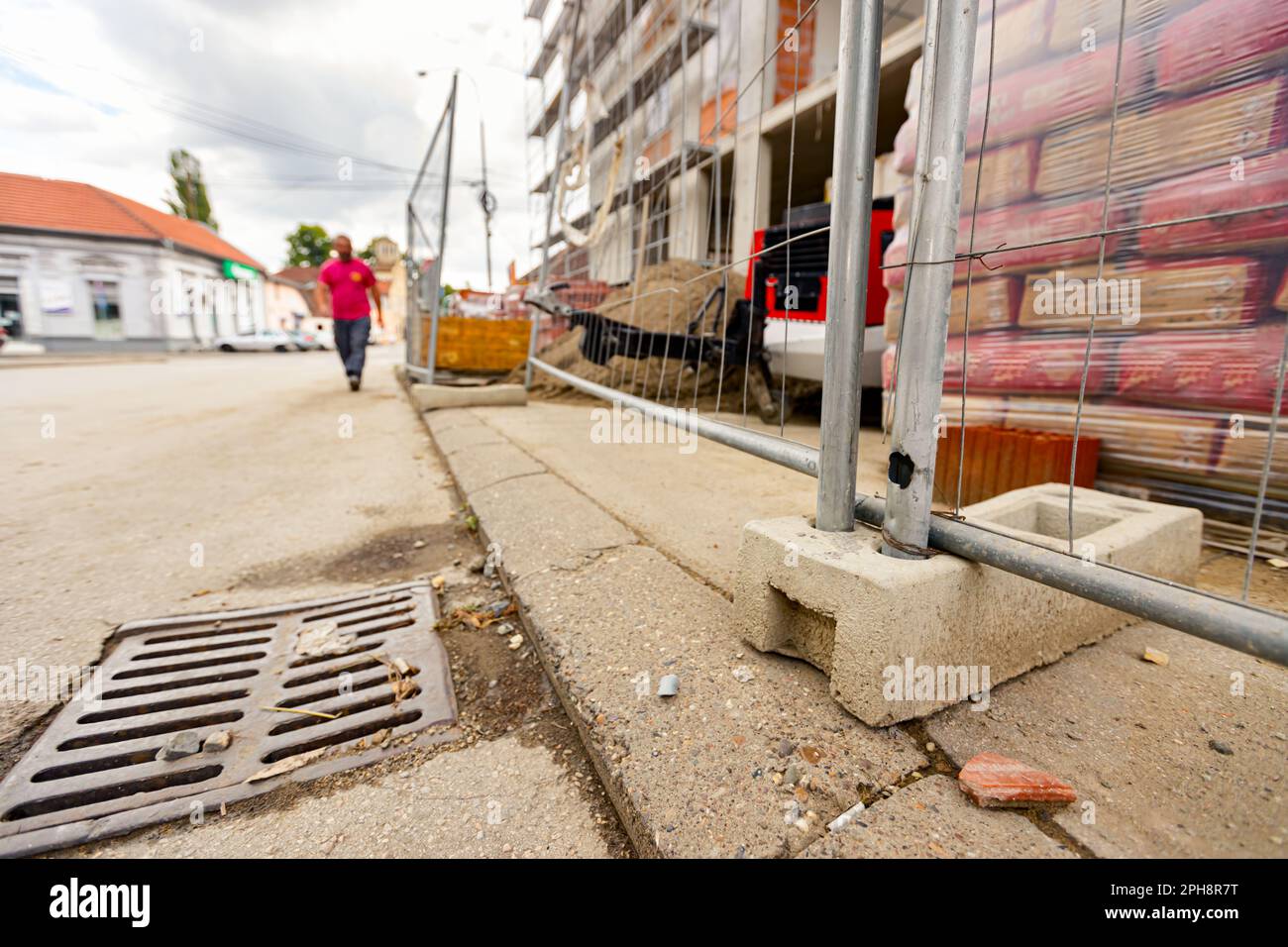 Metal wire fence placed on concrete hollow block foot for stability ...