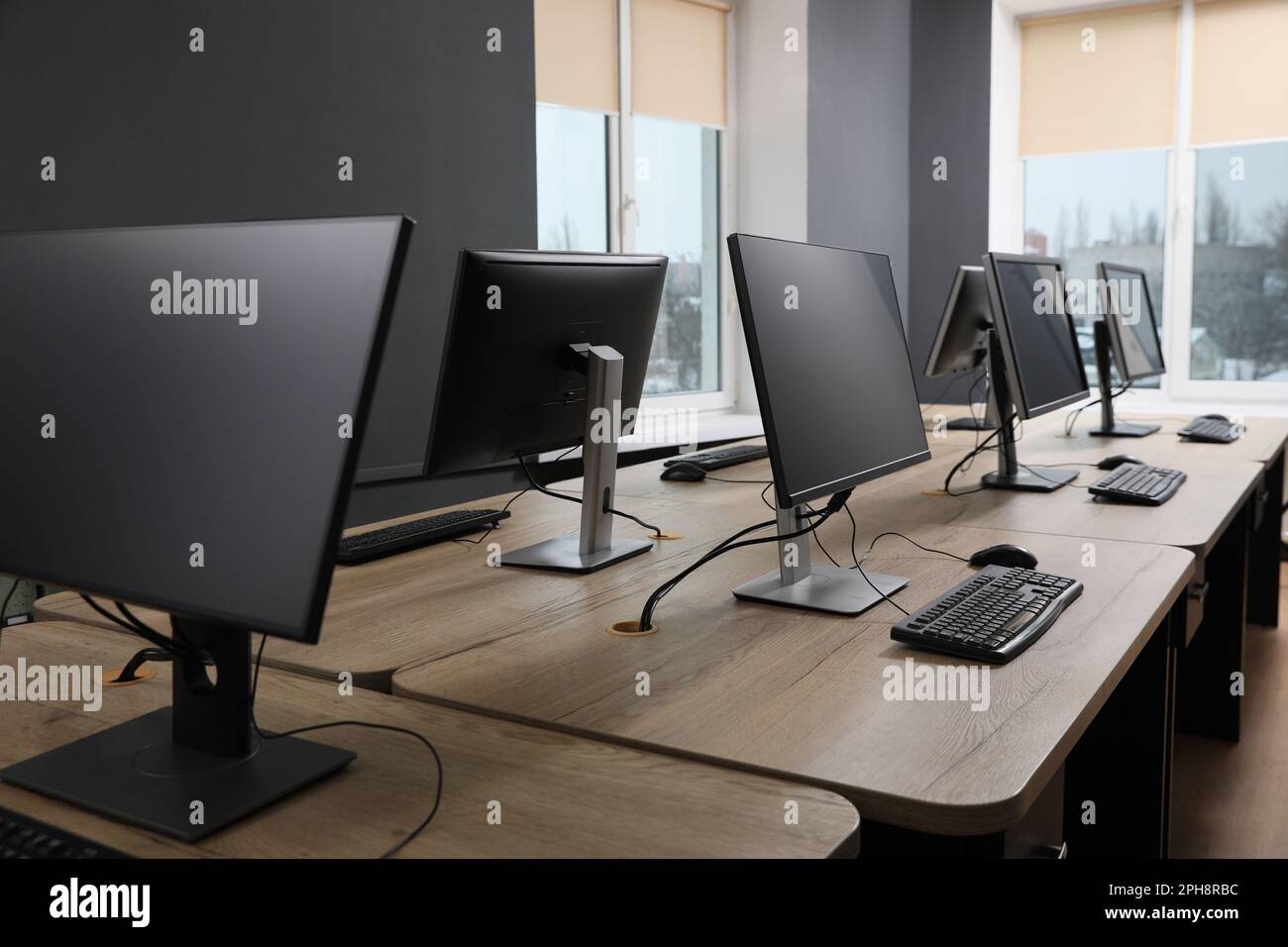 Many modern computers in open space office Stock Photo - Alamy