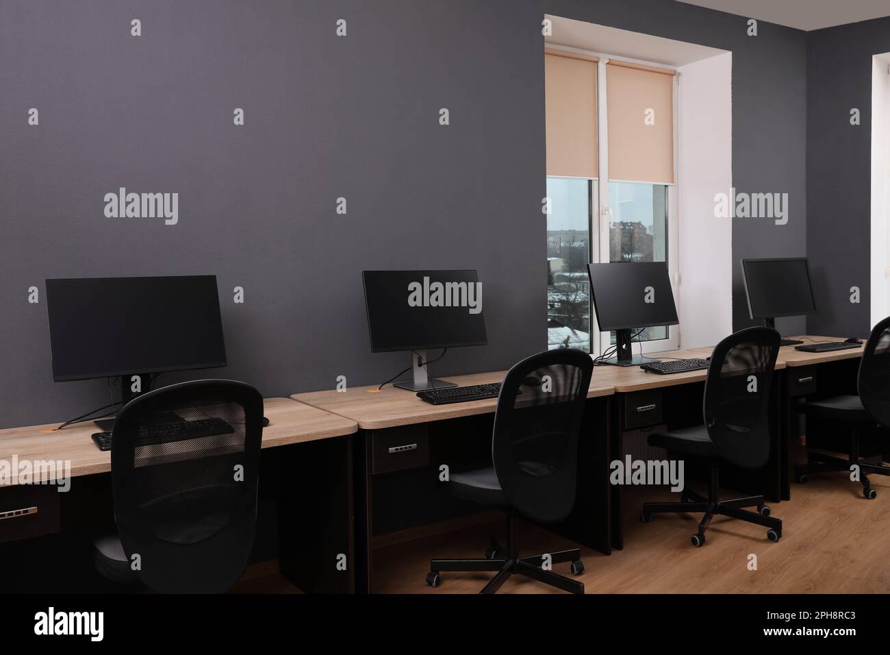 Many modern computers in open space office Stock Photo - Alamy