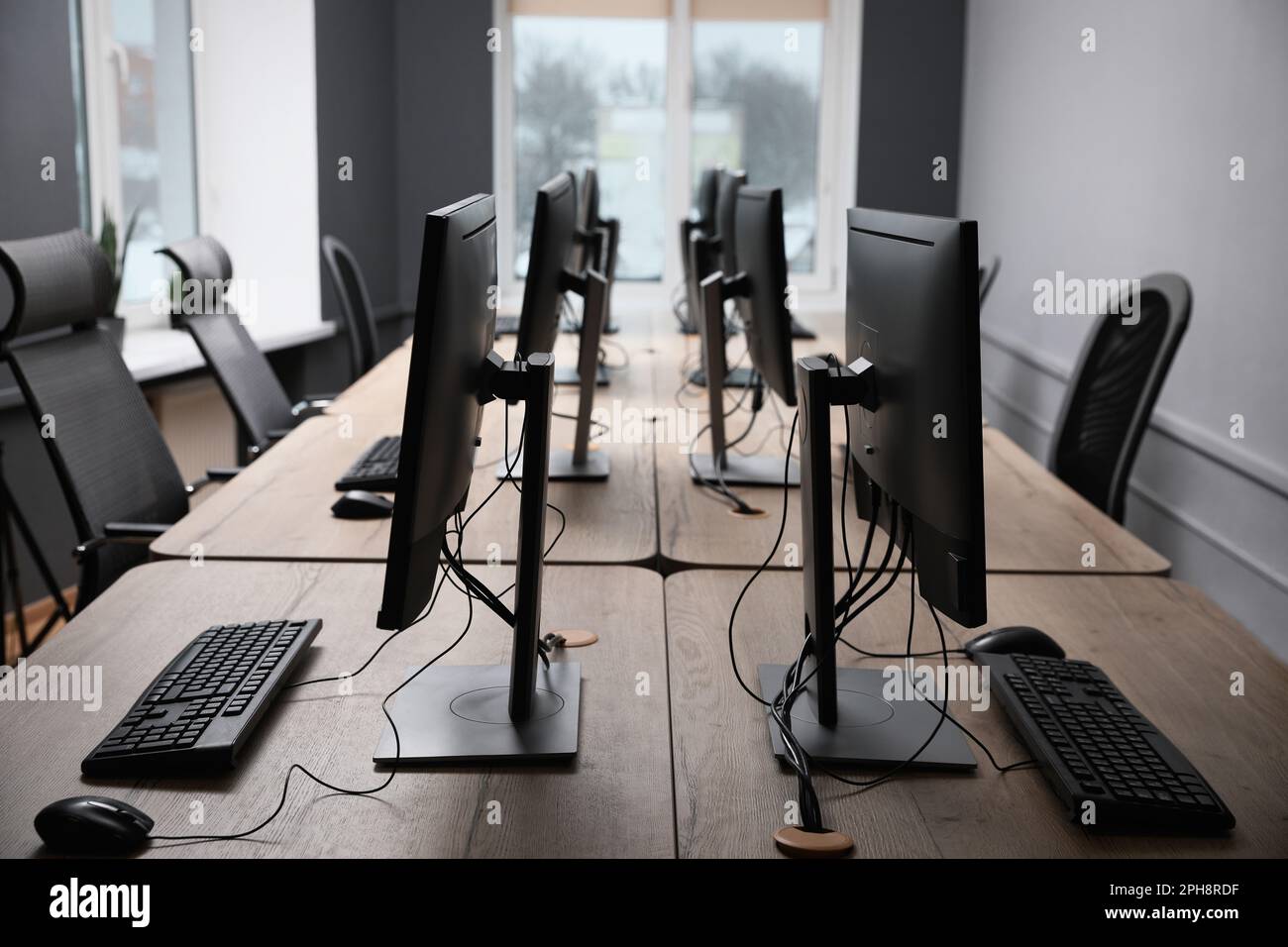 Rows of computers in empty office hi-res stock photography and images ...