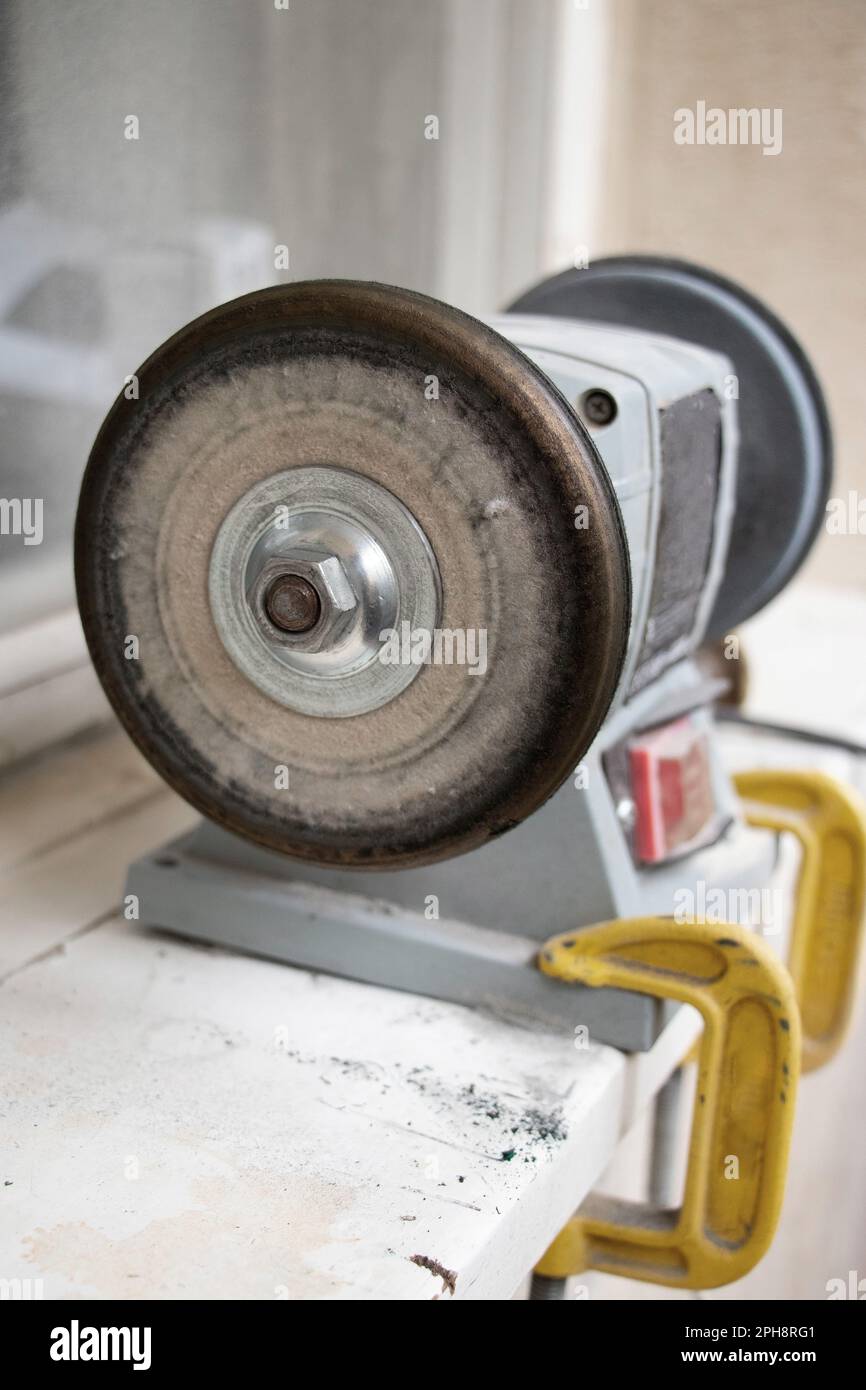 grinding machine on shelves at home close up, home workshop Stock Photo ...