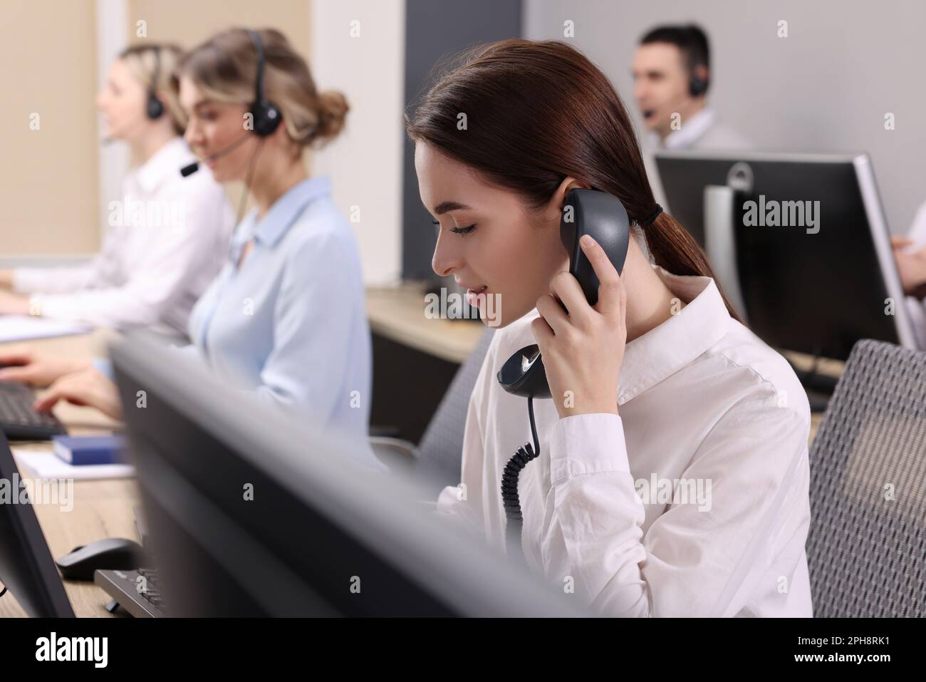 Male female call center operators hi-res stock photography and images ...