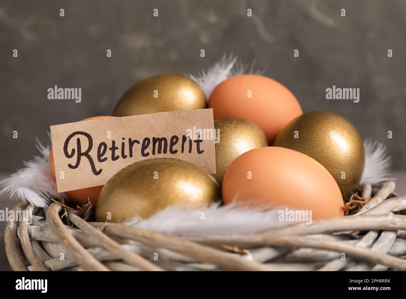 Different eggs and card with word Retirement in nest, closeup. Pension ...