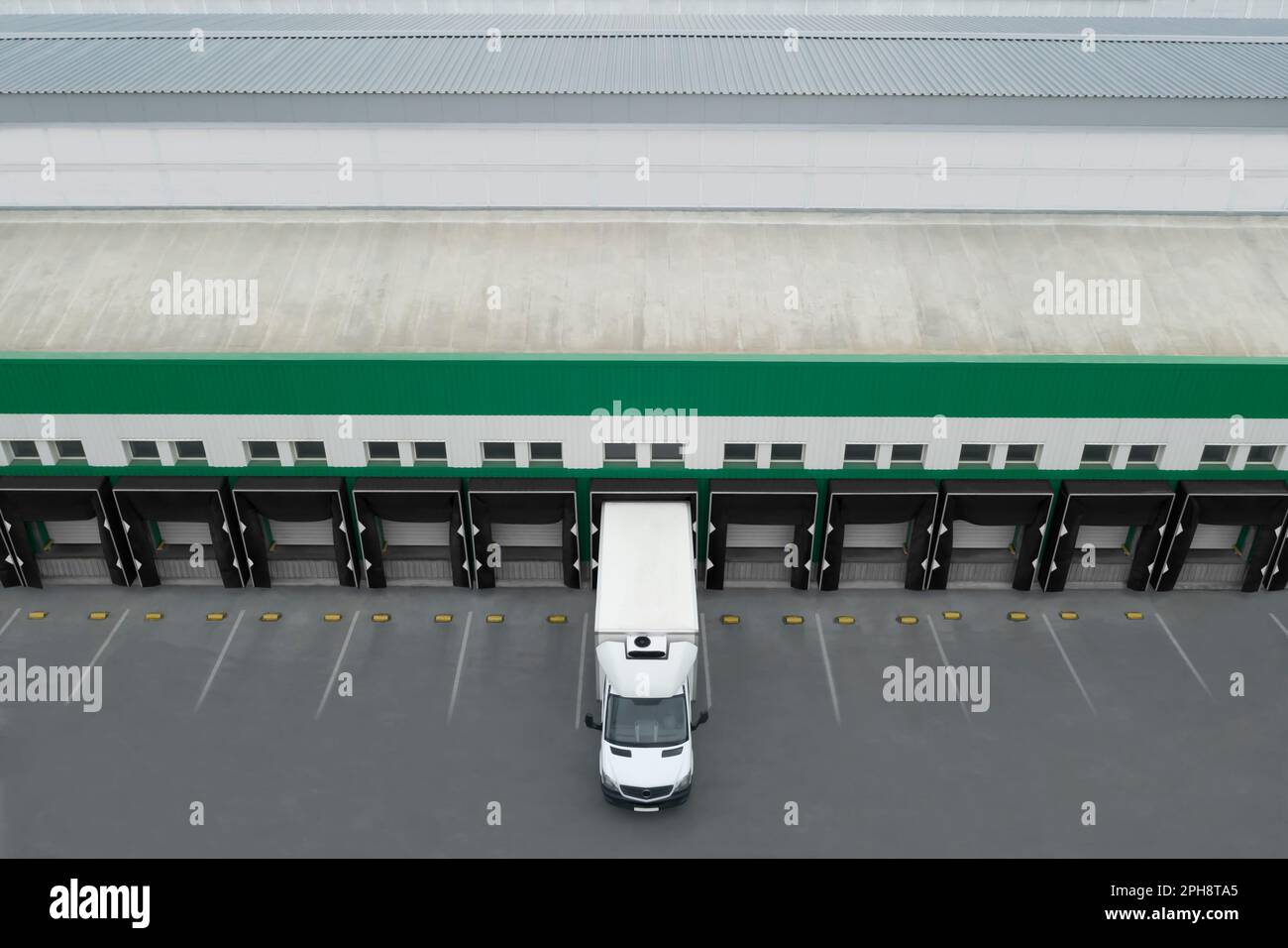 Truck near loading dock of warehouse outdoors, aerial view. Logistics ...