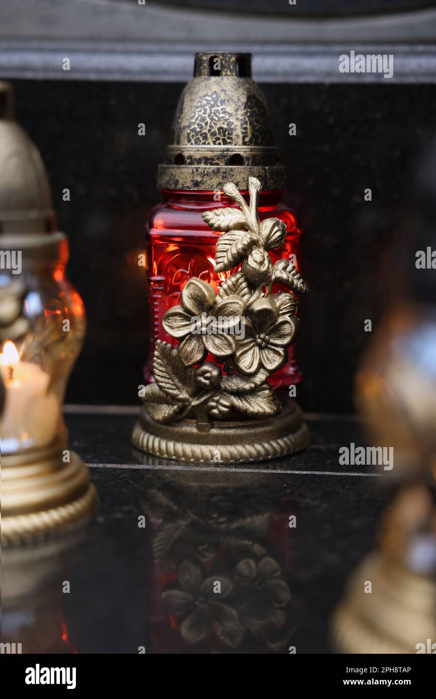 Grave lights on granite surface at cemetery Stock Photo - Alamy