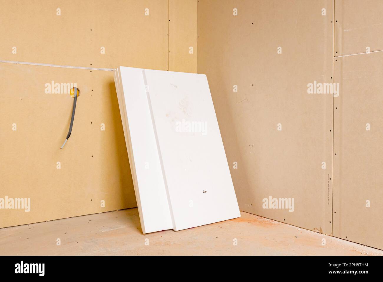 A few pieces of plaster boards are waiting to be installed on the ...