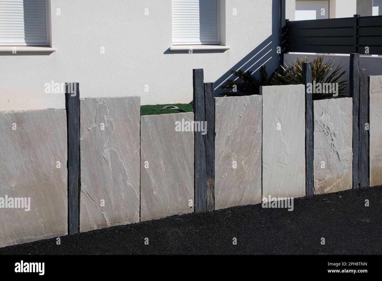 fence carved stone tiles modern barrier granite house wall garden Stock ...