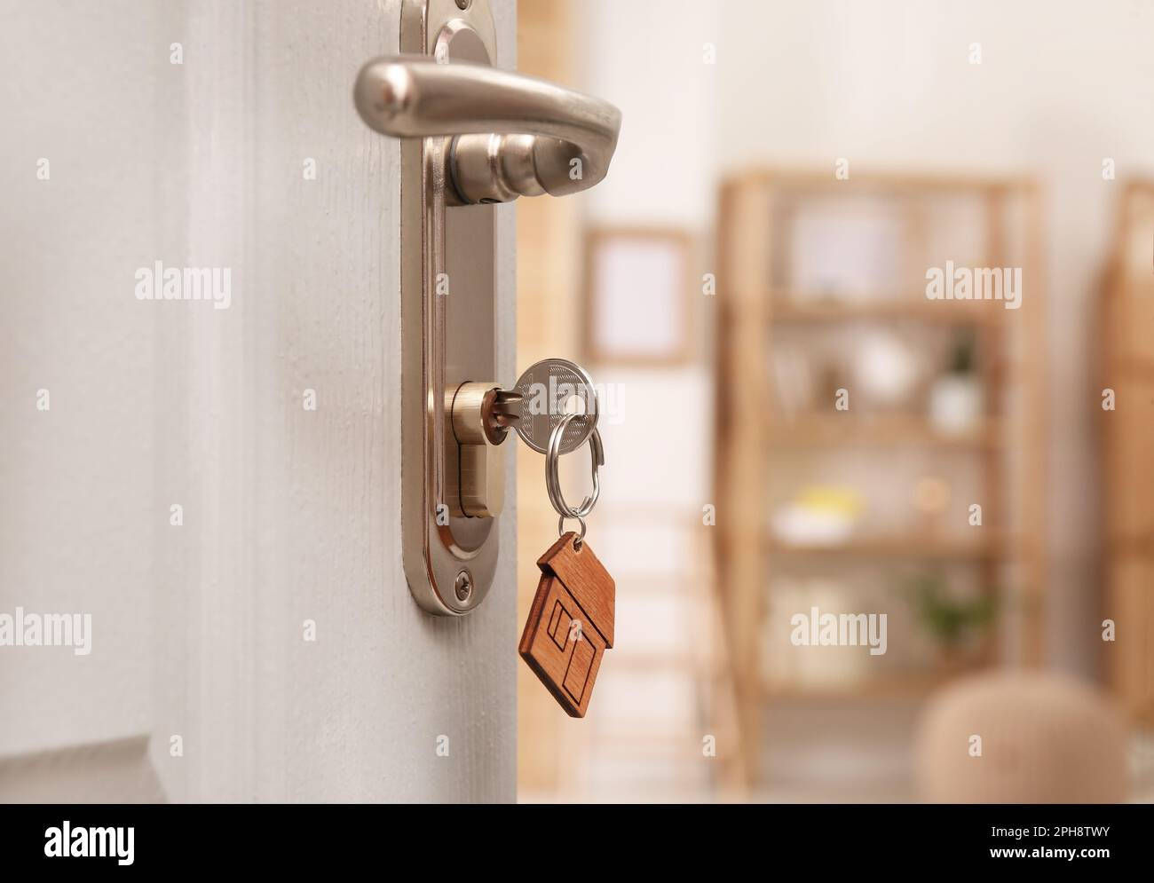 Open door with key in room, closeup Stock Photo - Alamy