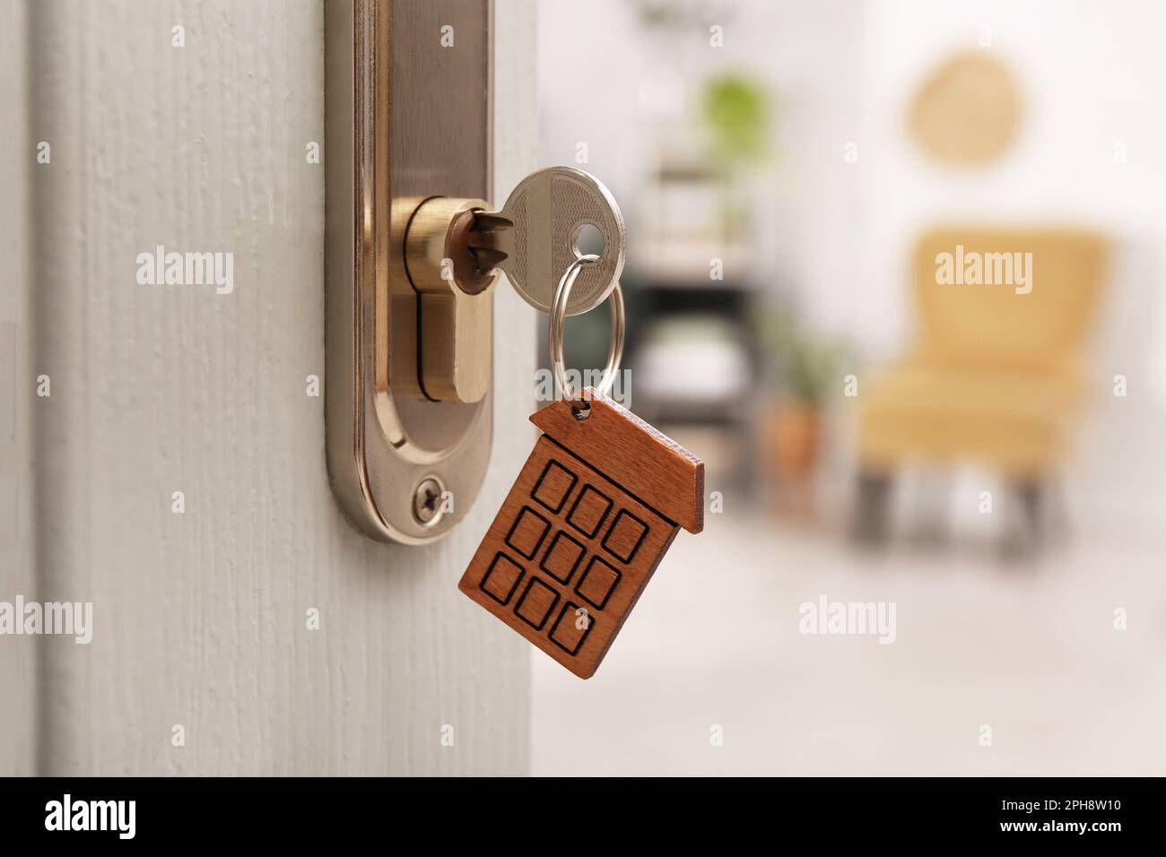Open door with key in room, closeup Stock Photo - Alamy