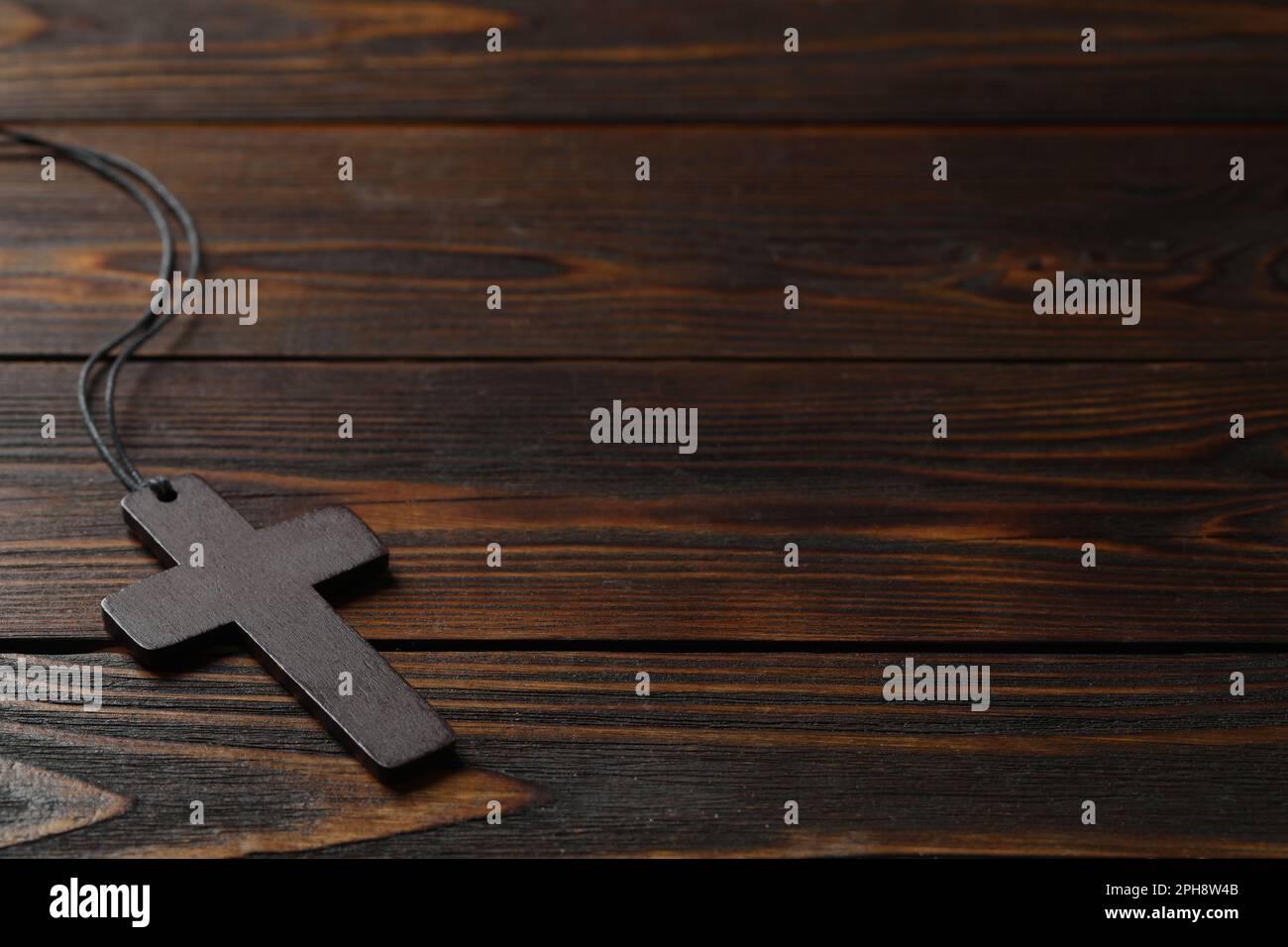 Wooden Christian cross on table, space for text Stock Photo - Alamy