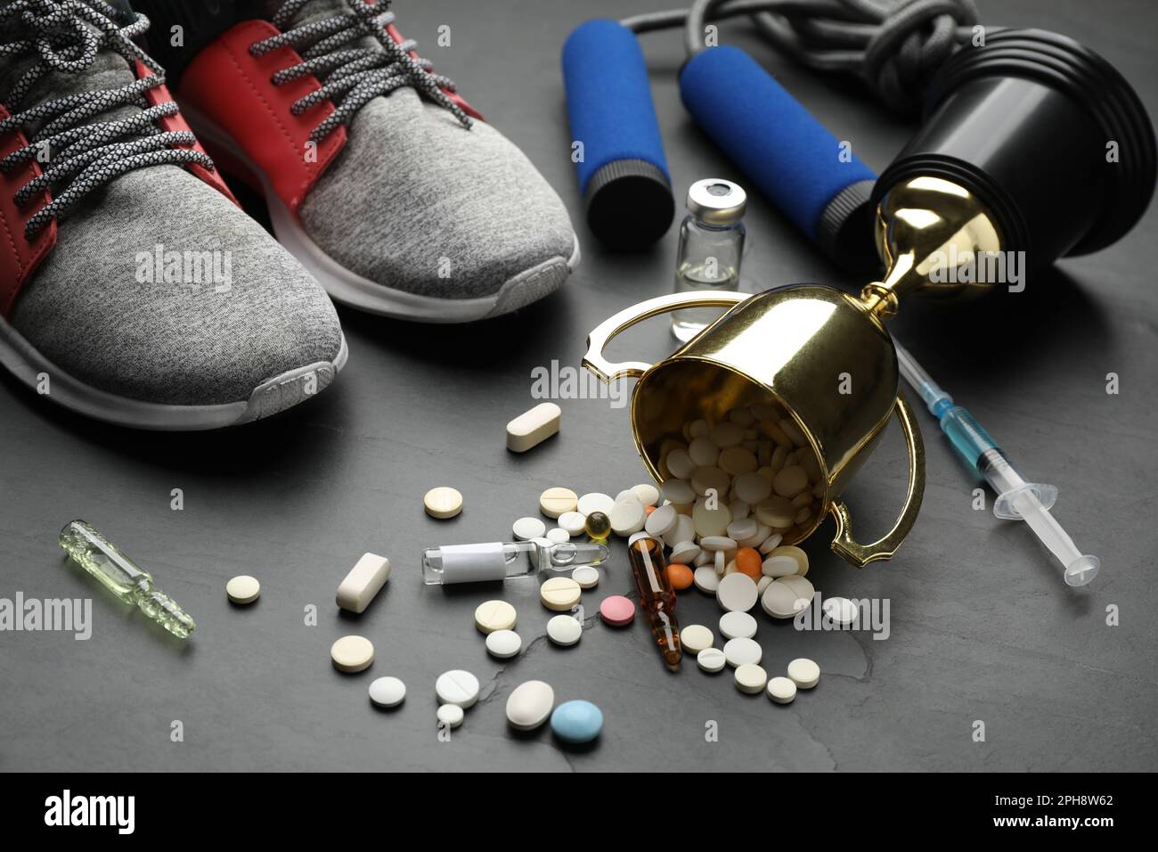 Composition with drugs on black table. Doping control Stock Photo - Alamy