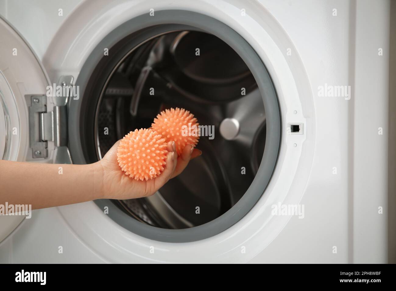 Woman washing machine eco hi-res stock photography and images - Alamy
