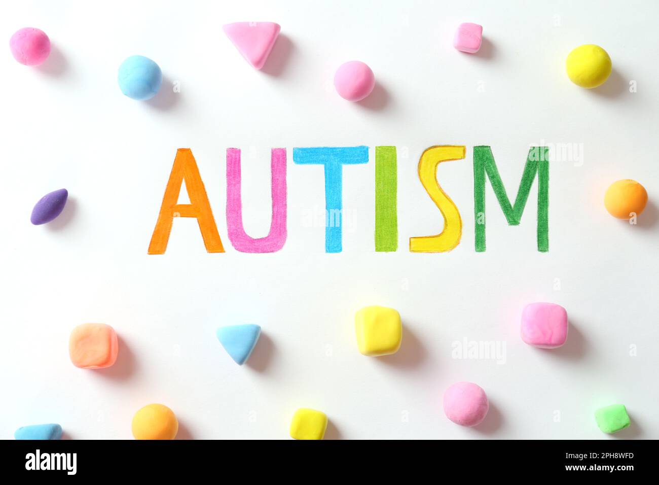 Word Autism and colorful plasticine figures on white background, flat ...