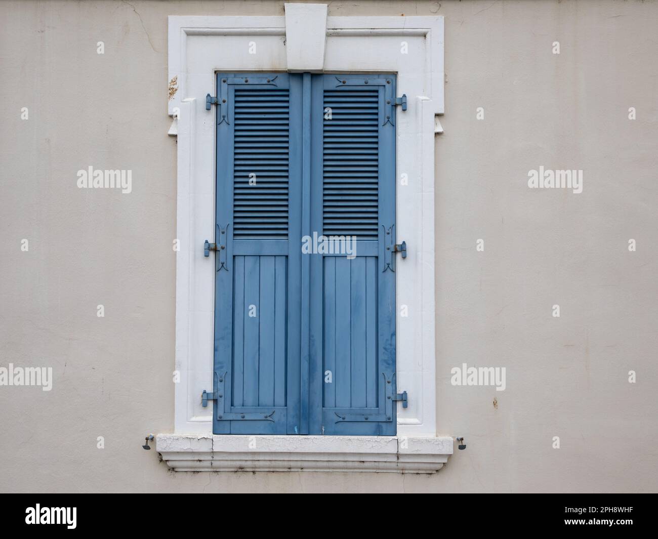 Old blue window and grey cement wall closed ancient facade shutter ...