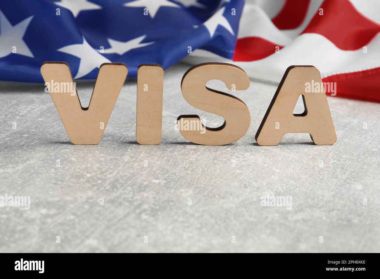 Word Visa and American flag on light grey table, space for text Stock ...
